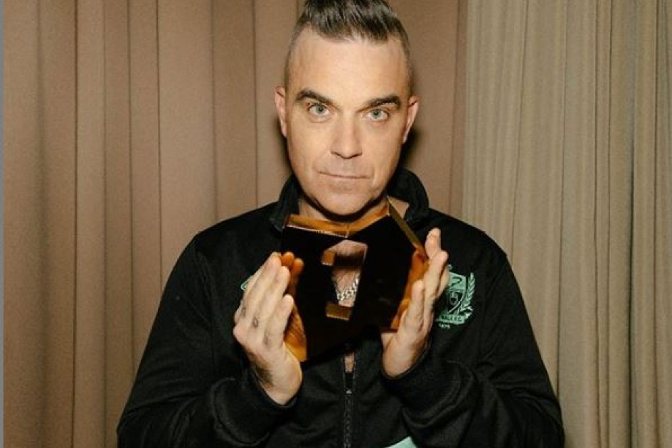 Singer Robbie Williams says his coronavirus symptoms went away after prayer
