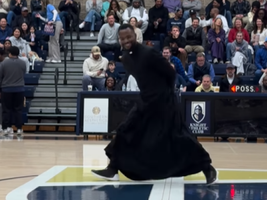 Priest stuns crowd with dance at basketball game
