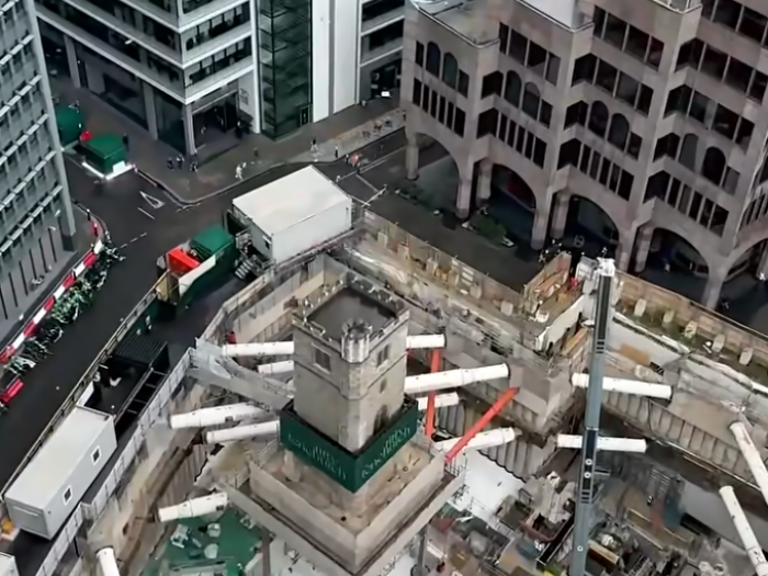 Medieval church tower in City of London resting on stilts for ...